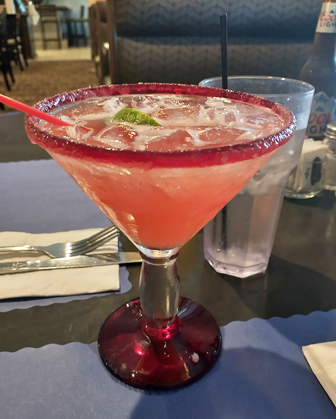 A ruby-red daiquiri with a sugar rim that's dressed better than most people at formal events. Sipping required, sharing optional.