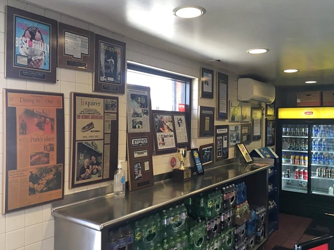 The wall of fame showcases decades of well-deserved accolades. Each framed article represents another food critic who fell hopelessly in love at first bite.