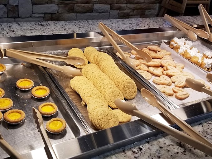 The dessert station features egg custard tarts that glow like little suns, alongside sugar cookies waiting for their moment in the spotlight.