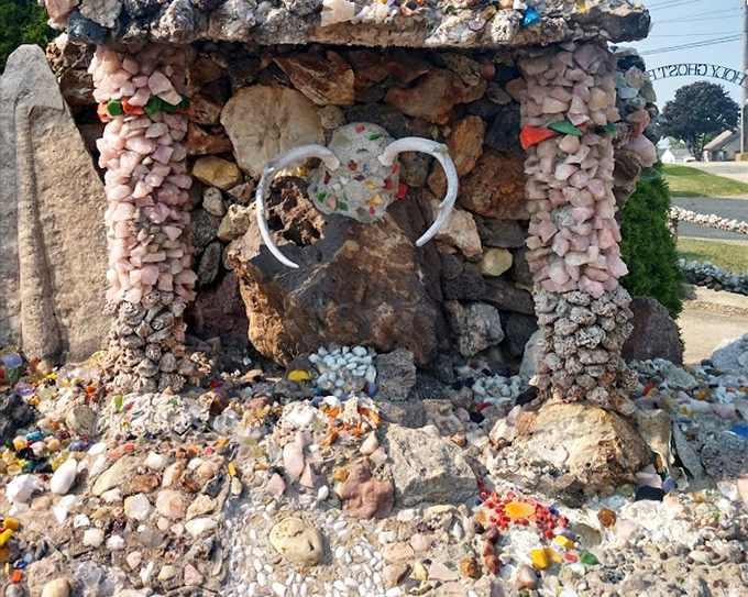 Nature meets artistry in this detailed rockwork&mdash;like someone gave the earth's crust a makeover with found objects and infinite patience.