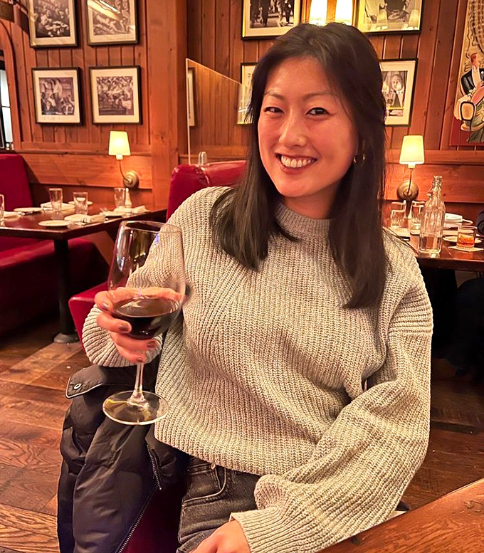 The warm wood interior creates an atmosphere where even strangers feel like they're in on a delicious secret.