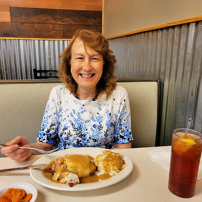 Happy diners enjoying that moment when the first bite exceeds all expectations&mdash;the universal language of food satisfaction.