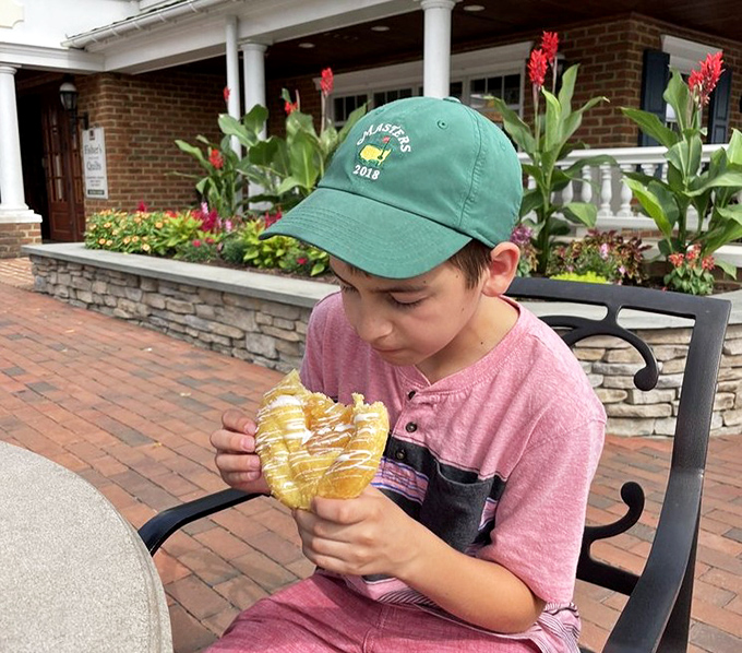 A young customer contemplates life's important questions, like "Can I eat this whole pretzel?" Spoiler alert: absolutely yes.