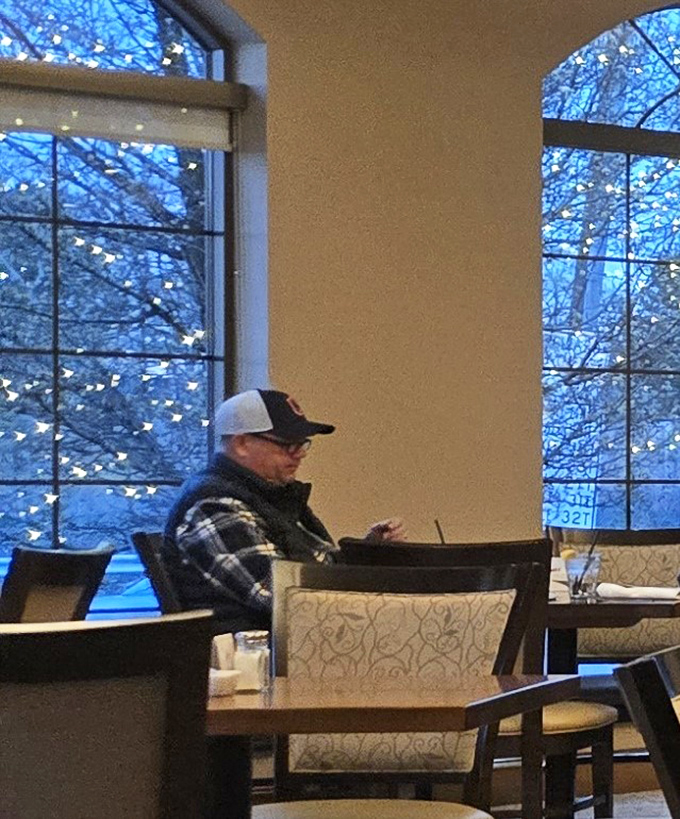 Winter light bathes the dining room in a gentle glow, creating a peaceful retreat where comfort food and comfort seating become one. 