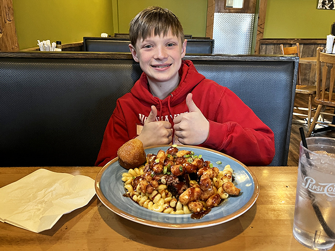 The universal language of barbecue satisfaction – thumbs up indeed for what appears to be a glorious plate of saucy goodness.