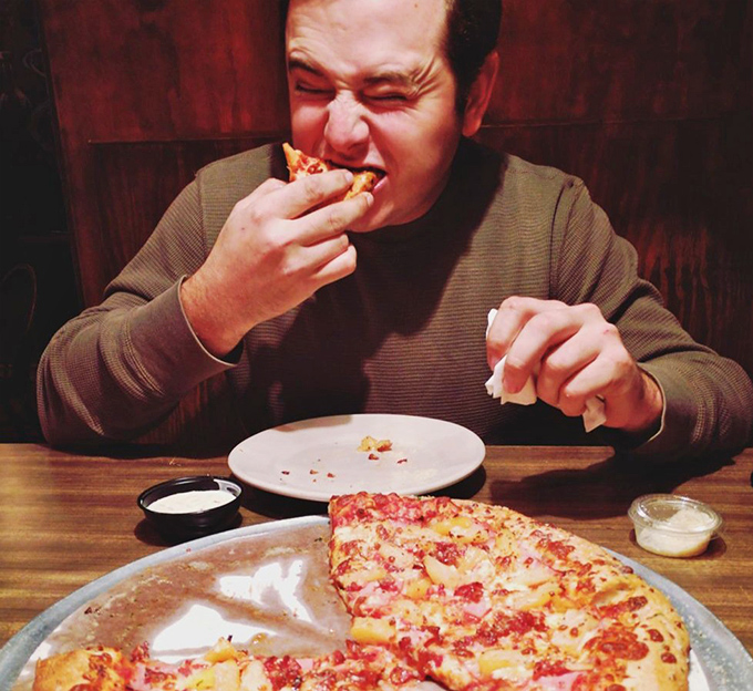 That face says it all &ndash; the universal expression of pizza bliss that transcends language, culture, and waistband limitations.