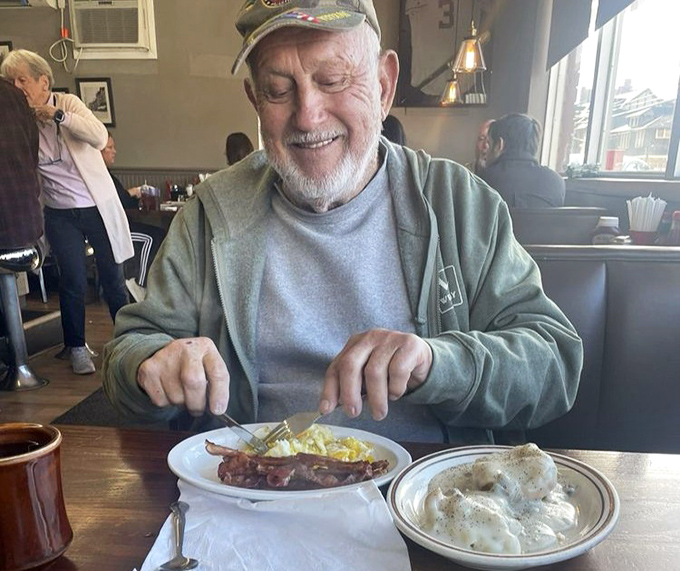 The joy of a good meal written all over this diner's face. Some restaurants feed your stomach; the best ones feed your soul too.