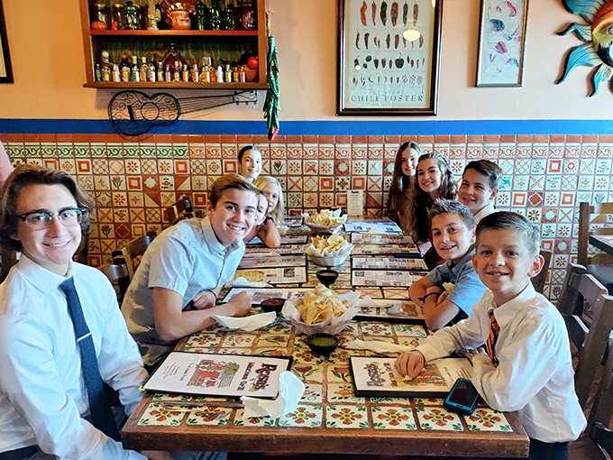 The universal language of good food brings families together. These young diners dressed in their Sunday best know that chips and salsa make any occasion special.