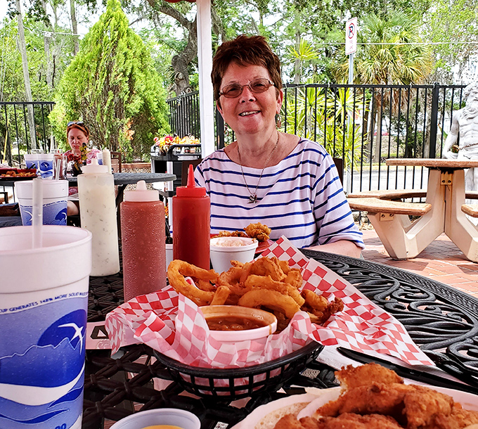Outdoor dining with a basket of fried treasures—proof that happiness can be found in the simplest pleasures. Florida sunshine meets New England flavor.