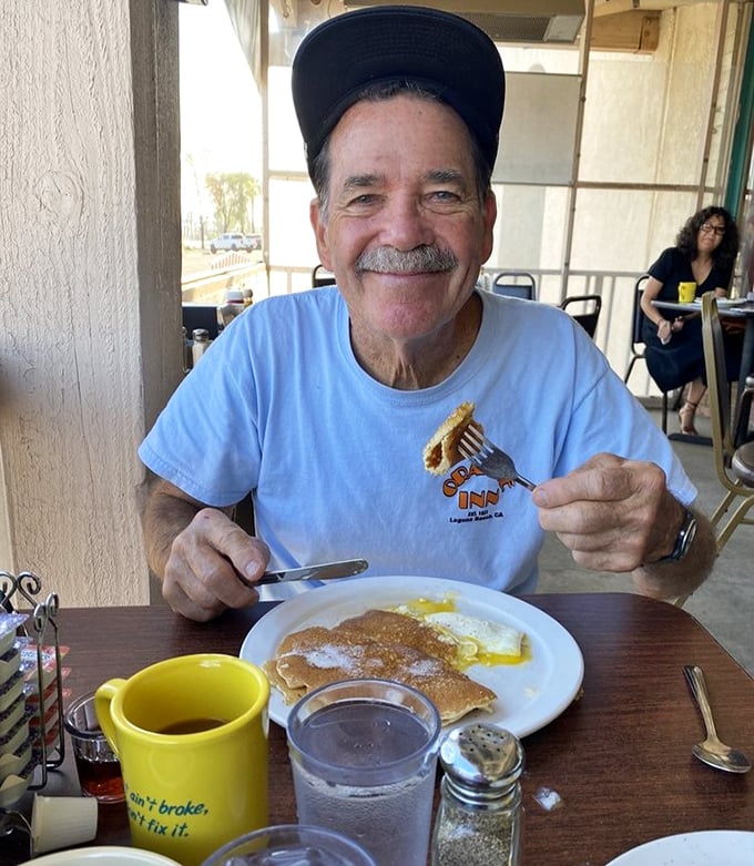 The joy of pancakes is universal&mdash;just look at that smile that says "I've found breakfast bliss and I'm not sharing."