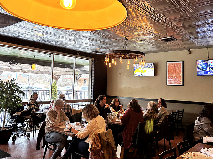 The dining room hums with conversation and laughter. Ornate ceiling tiles and pendant lights create the perfect backdrop for making memories over meals.