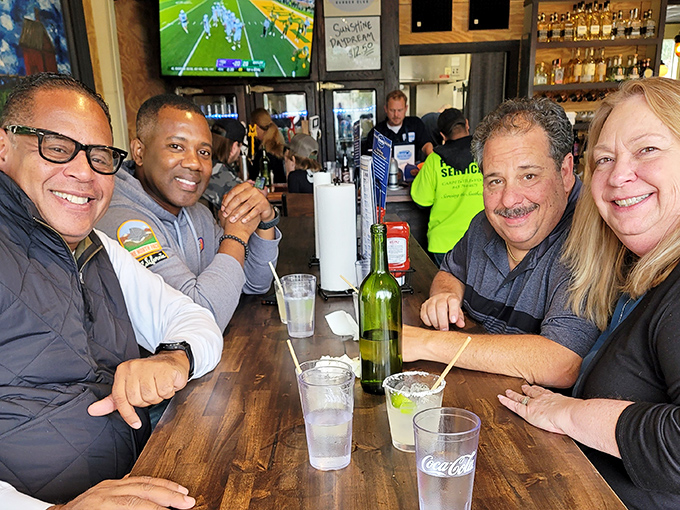 The true measure of a great restaurant: happy faces around the table, cold drinks in hand, and sports on the TV.