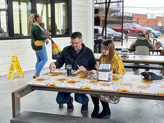 The universal language of good food bringing people together. That focused expression says everything about the burger-eating experience.