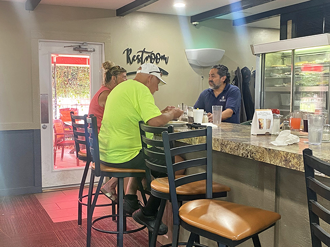The counter seating &ndash; where solo diners become temporary neighbors and the green-shirted regular probably knows all the town's best stories.
