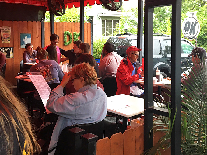 The outdoor seating area buzzes with the energy of people who've made the right breakfast decision, their faces illuminated with pre-pancake joy.