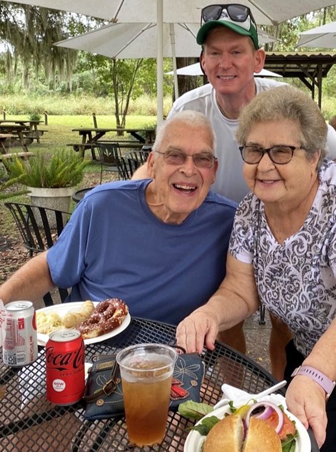 The outdoor biergarten brings together locals and visitors alike, proving that great food creates community faster than any social media platform ever could.