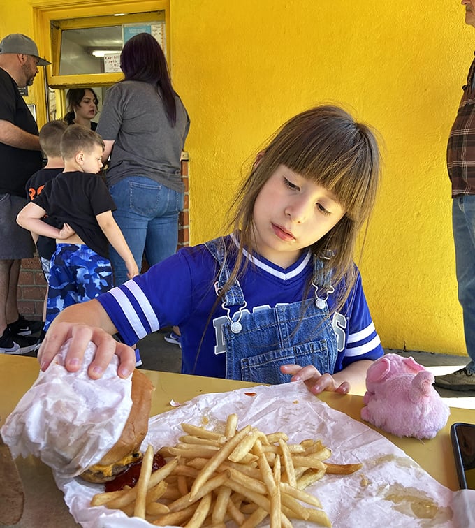The outdoor dining experience at The Munch Box is a family affair, where memories are made between bites of perfectly crafted comfort food.