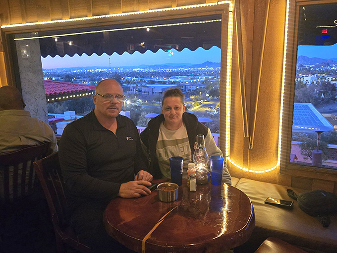 The million-dollar view comes free with dinner. Phoenix lights twinkle below while you contemplate another bite of that massive steak.