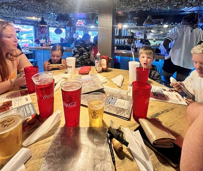 Family dining at its finest—where smartphones occasionally surrender to actual conversation and the shared joy of breaking bread together.