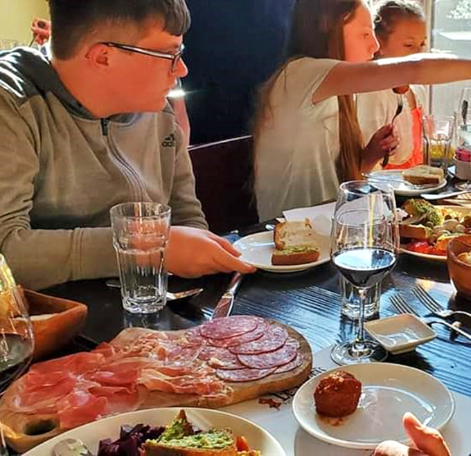 The true test of any Italian restaurant: locals gathering to share food, wine, and conversation. A charcuterie board that demands to be photographed first.