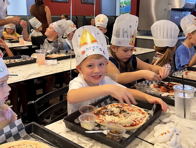 Pizza-making classes where kids learn the ancient art of topping distribution. Future chefs in training, or just clever parents ensuring dinner help?