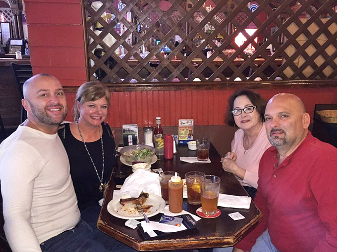 The universal language of barbecue brings people together. Those smiles say everything words can't about The Bar-B-Q Shop experience.