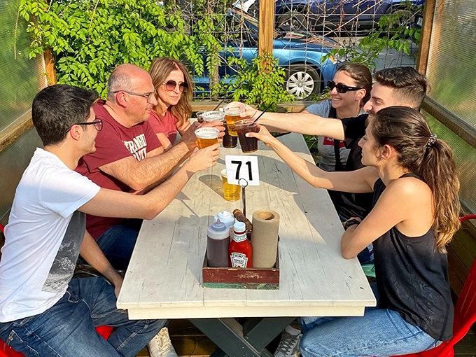 The universal language of "cheers" brings friends together at Walter's outdoor tables, where barbecue creates the kind of memories that Facebook can't properly capture.