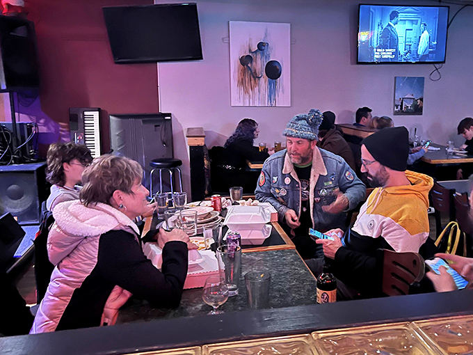 The true measure of a neighborhood joint: tables filled with locals sharing stories, laughter, and the unspoken agreement that calories don't count among friends.
