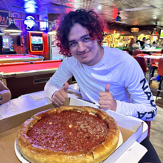 The universal expression of pizza happiness knows no age limit. Two thumbs up indeed &ndash; this deep dish has clearly found its fan.