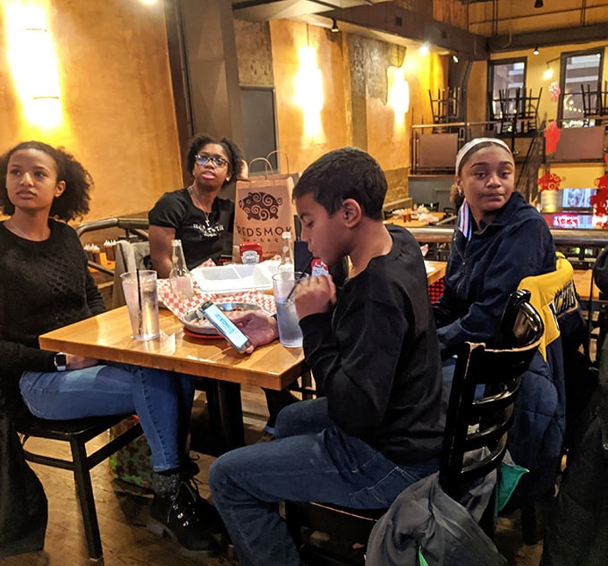 The universal language of barbecue brings people together&mdash;notice how nobody's talking because their mouths are happily occupied with smoked goodness.