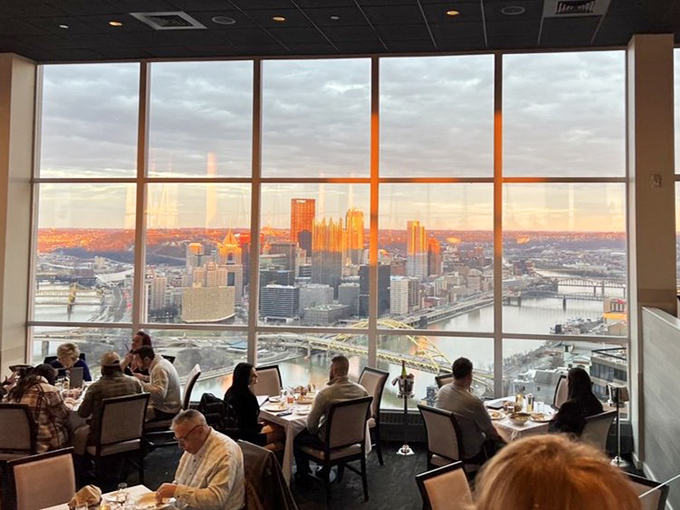 Sunset transforms Pittsburgh into a golden kingdom, and these diners scored the best seats in the house. Food tastes better with a view like this.