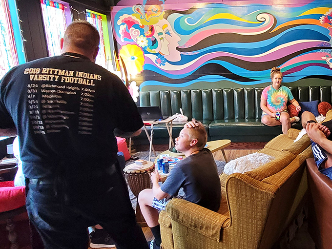 The lounge area feels like your coolest friend's basement circa 1975, if your friend had impeccable taste and a drum circle. Peace, love, and pizza indeed.