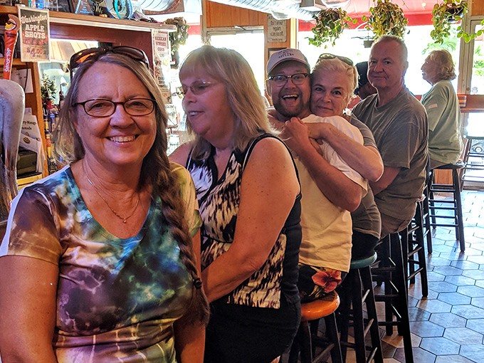 Happy locals lined up at the bar, proving this place has the secret sauce for both food and community.