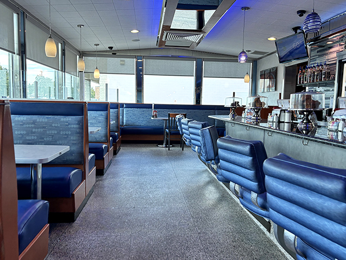 The dining area balances retro charm with modern comfort. Those blue booths have cradled countless family celebrations, first dates, and "I'm-too-full-to-move" moments.