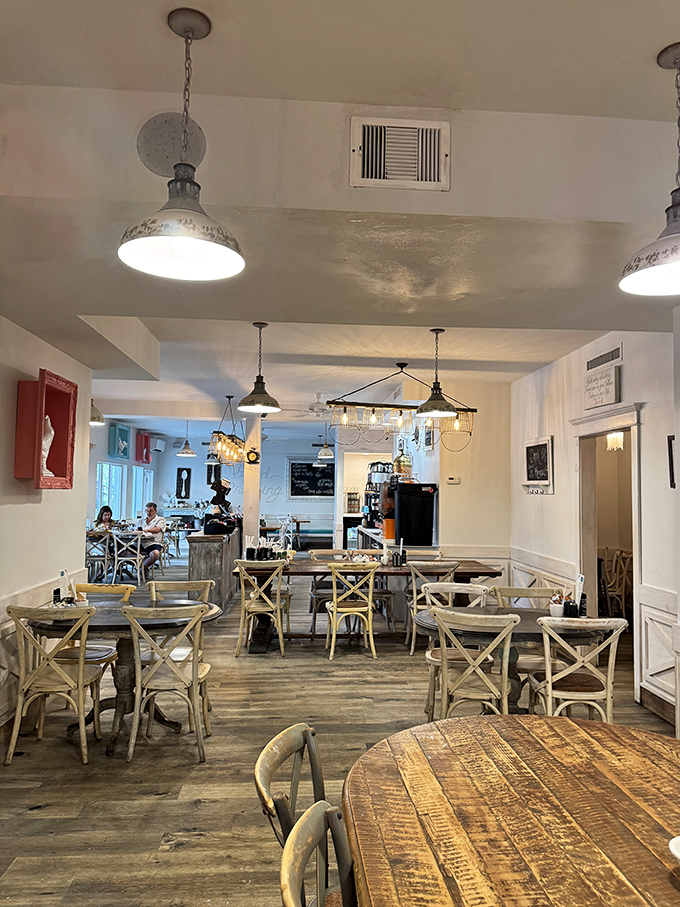 Rustic wood tables and cross-back chairs create the perfect backdrop for memorable meals and meaningful conversations.