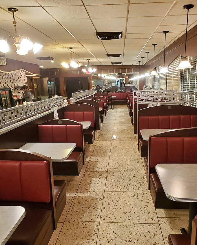 The empty dining room waits for its next wave of hungry patrons. Those red booths have cradled countless Pittsburgh conversations.
