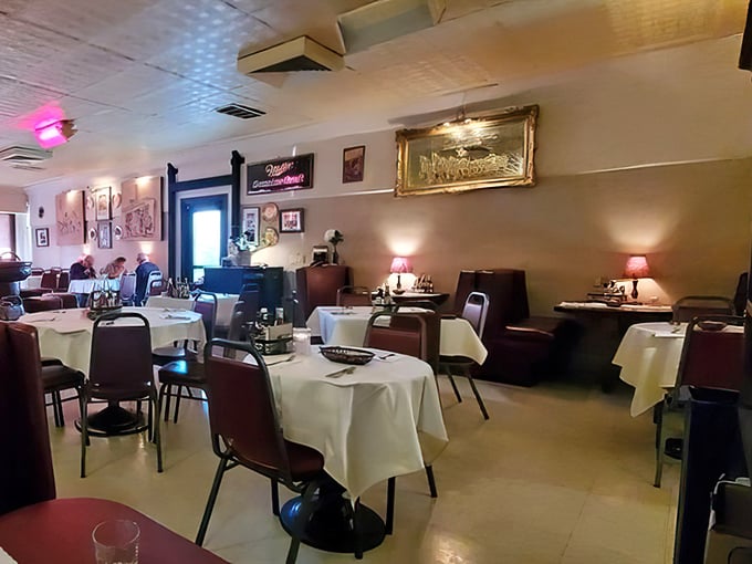 White tablecloths and satisfied diners create that perfect steakhouse symphony of contentment and conversation.