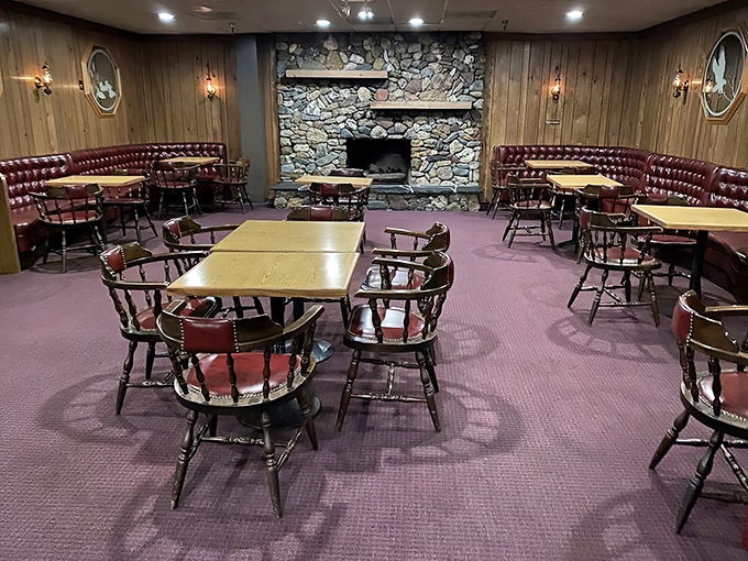 The stone fireplace anchors the dining room like a campfire, reminding us that cooking meat over flame is humanity's oldest tradition.
