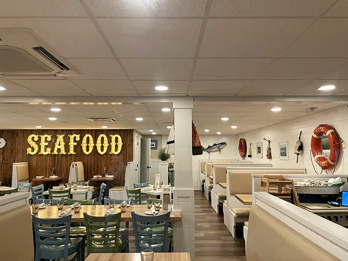 The "SEAFOOD" sign glows like a beacon of hope for hungry travelers seeking maritime delights in a sea of ordinary dining options.