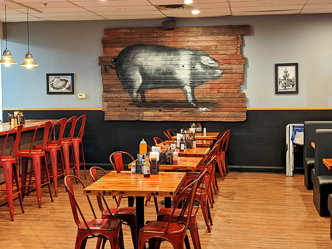 The rustic pig mural watches over diners like a patron saint of pork, silently blessing each table with smoky goodness.