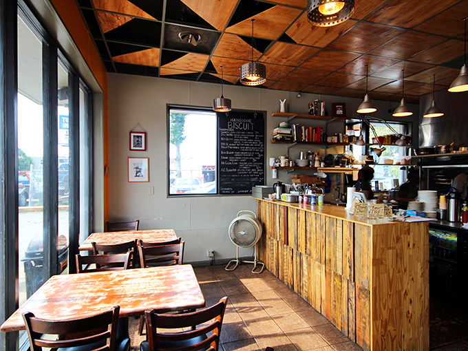 The dining area feels like eating in a friend's stylishly rustic kitchen. Wood, metal, and natural light create the perfect stage for biscuit enjoyment.