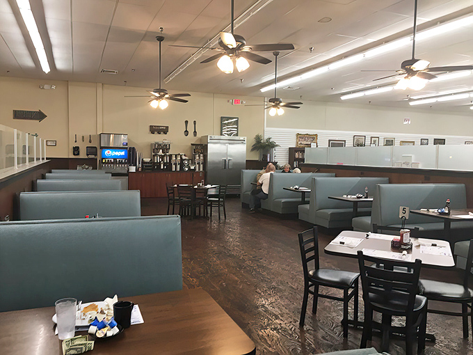 The dining room &ndash; where ceiling fans gently stir the aromas of home cooking and blue booths invite you to stay awhile.