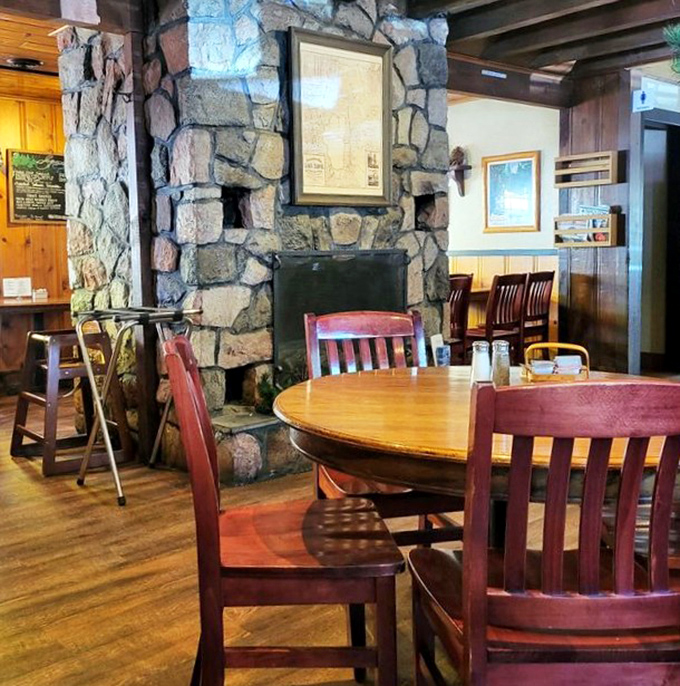 Stone fireplace meets wooden charm &ndash; where breakfast conversations linger and nobody's checking their watch. Time slows down here.