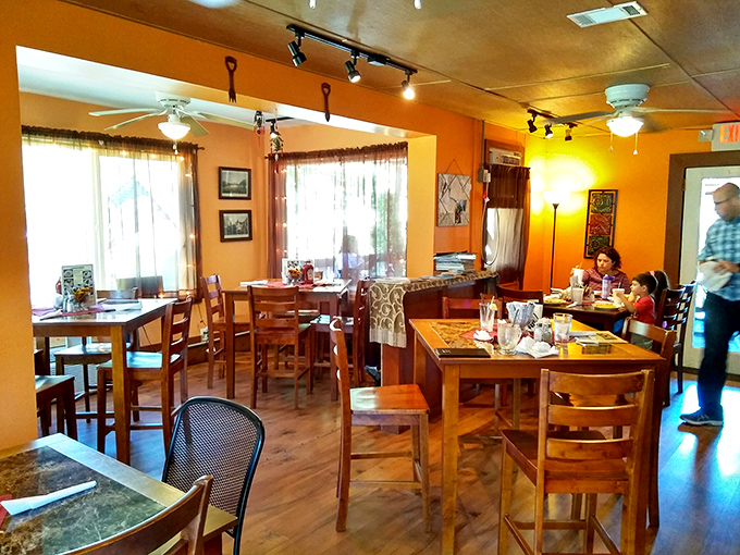 Warm orange walls and wooden tables create a dining space where you'll want to linger long after your plate is clean.