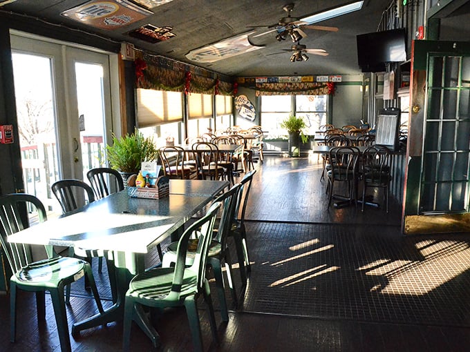 Sunlight streams through windows in this bright dining area, creating the perfect backdrop for both intimate conversations and boisterous gatherings.