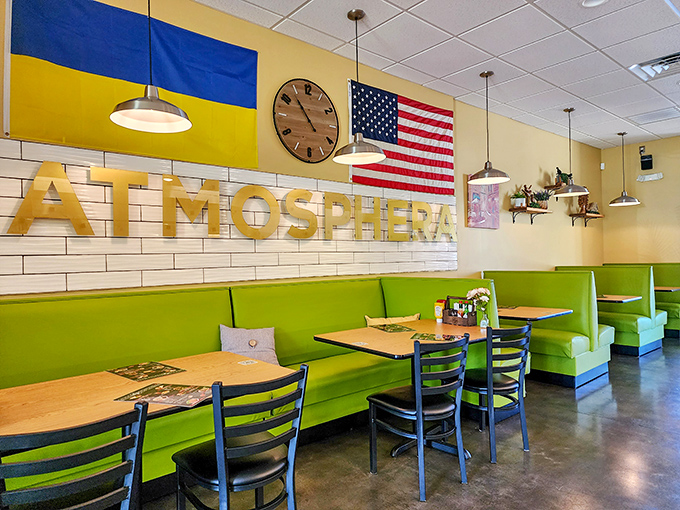 The dining area feels like Eastern Europe's cheerful cousin moved to Myrtle Beach. Those green booths practically invite you to settle in for the afternoon.
