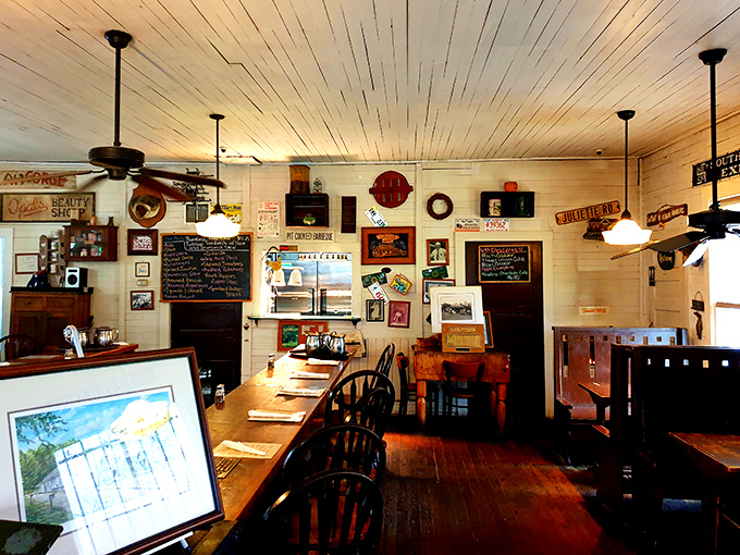 Wooden tables bathed in golden light, ceiling fans lazily turning overhead. The kind of place where strangers become friends over shared stories and second helpings.