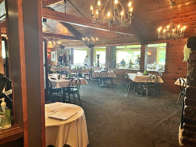 Chandeliers cast a warm glow over white tablecloths, creating the perfect backdrop for memorable meals and even better conversations.