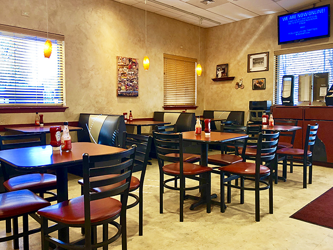 The dining area's warm tones and simple furnishings say, "Stay awhile, there's no rush when you're having a religious pizza experience."