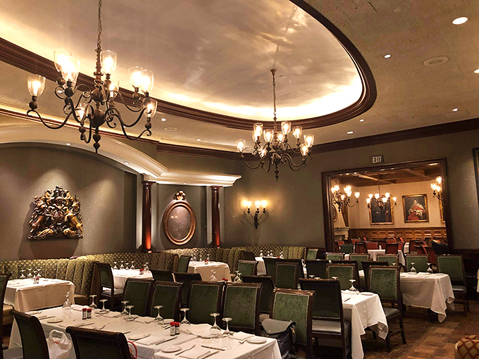 The elegant dining room with its curved ceiling details creates an atmosphere where time slows down and dinner becomes an event worth dressing up for.